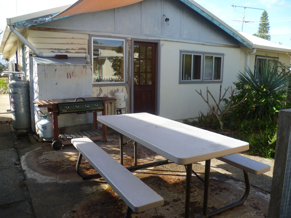 Old style beach house with views of the river joining the ocean : Deals ...