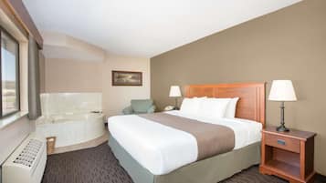 Suíte luxo, 1 cama King, para não fumantes | Escrivaninha, cortinas blackout, quartos à prova de som