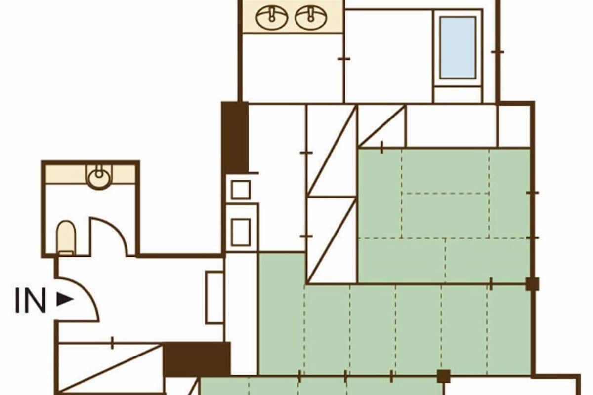 Planta baixa com cozinha, sala de jantar e dois quartos.