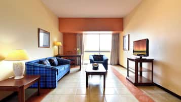 Suite Executiva | Sala de estar | Televisor