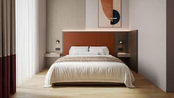 Edredões de penas, minibar, cofre no quarto, secretária