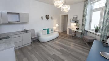Quarto casal standard | Área de estar | TV de tela plana