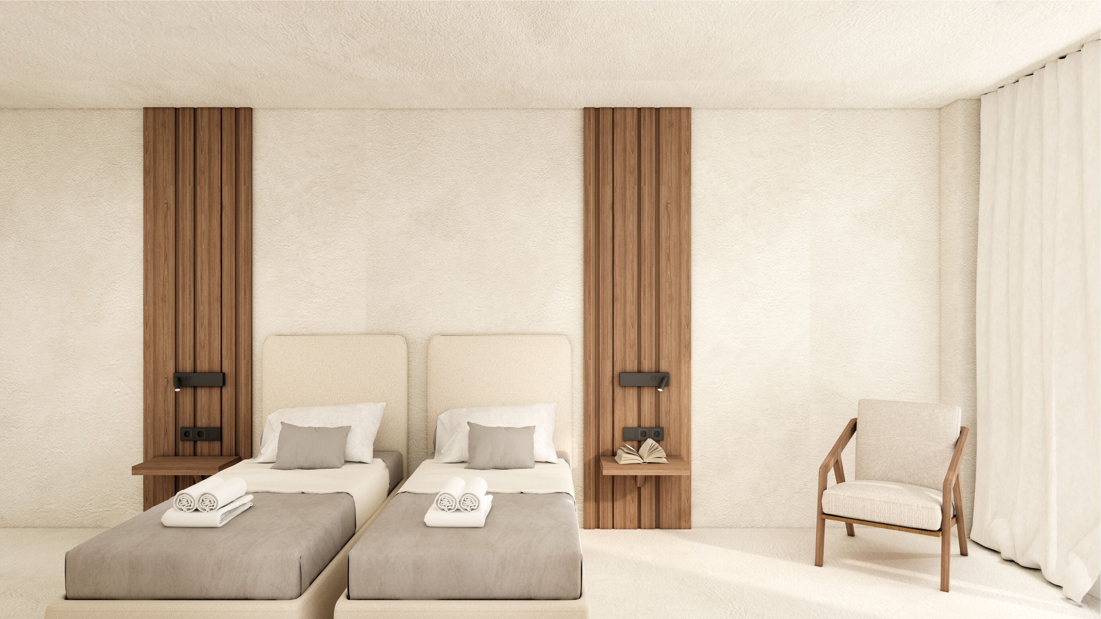 Quarto de hotel com duas camas, uma cadeira e uma mesa de cabeceira com um livro.