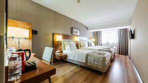 Quarto triplo | Frigobar, cofres nos quartos, escrivaninha, cortinas blackout