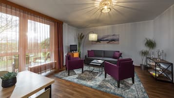 Condo, 1 quarto | Área de estar | TV de tela plana