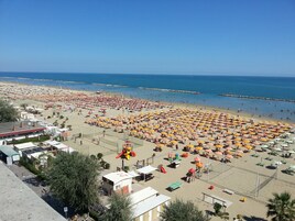 Na praia, barracas de praia (sobretaxa), toalhas de praia