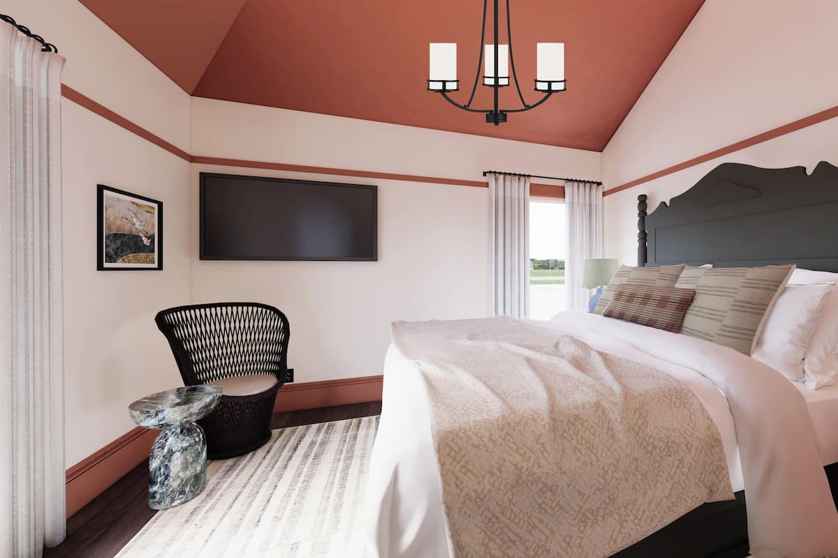 Quarto com cama, televisão, cadeira e mesa de cabeceira.