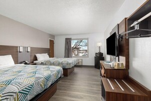 Escrivaninha, cortinas blackout, Wi-Fi de cortesia, roupa de cama