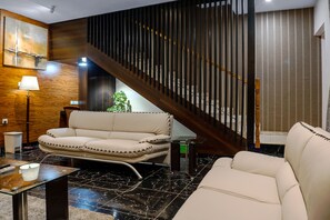 Apartamento superluxo, 2 quartos | Área de estar