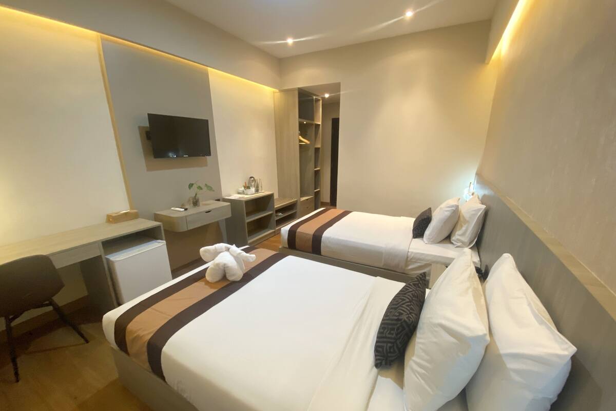 Quarto Twin Empresarial | Cortinas/cortinados opacos, ferro/tábua de engomar, Wi-fi grátis