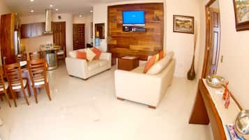 Apartamento, 2 quartos | Sala de estar | TV de tela plana 40 polegadas com canais via satélite, TV