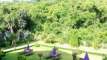 Quarto luxo | Vista para o jardim