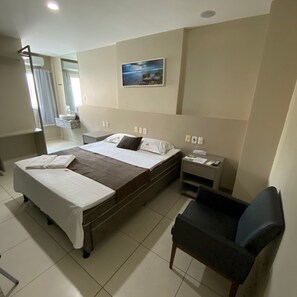 Quarto Individual | Minibar, Wi-fi grátis, roupa de cama fornecida