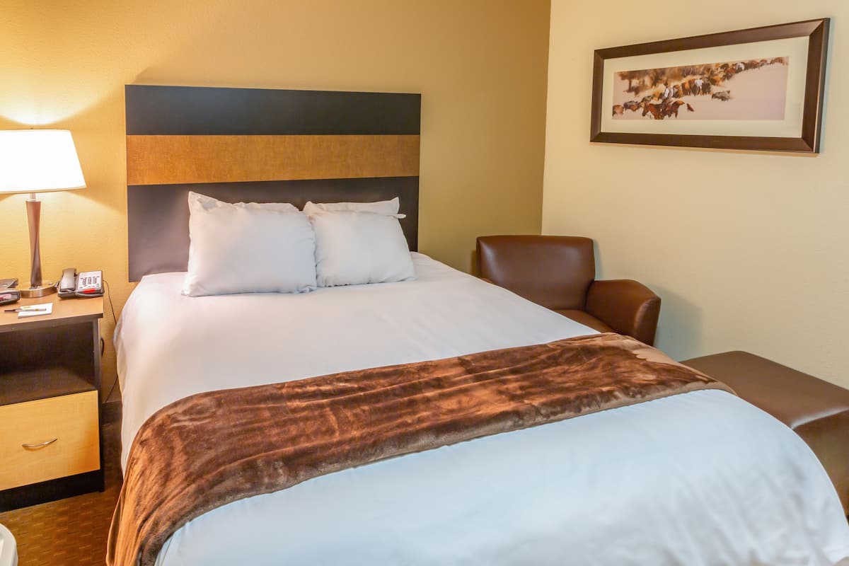 Roupas de cama premium, camas com colchões pillow-top, cortinas blackout