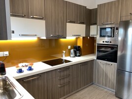 Casa luxo, 3 quartos, vista para o mar, de frente para o oceano | Cozinha privada | Cafeteira/chaleira, geladeira, micro-ondas, cooktop