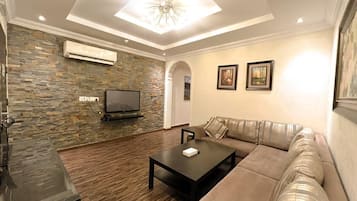 Apartamento família, 2 quartos | Área de estar