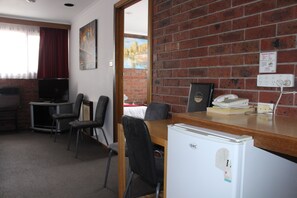 Quarto família | Área de estar | TV