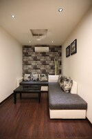 Quarto Empresarial | Sala de estar | Televisor LCD 