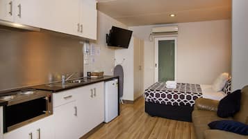 Bungalow Básico, 1 quarto | 1 quarto, ferro/tábua de engomar, Wi-fi grátis, roupa de cama fornecida