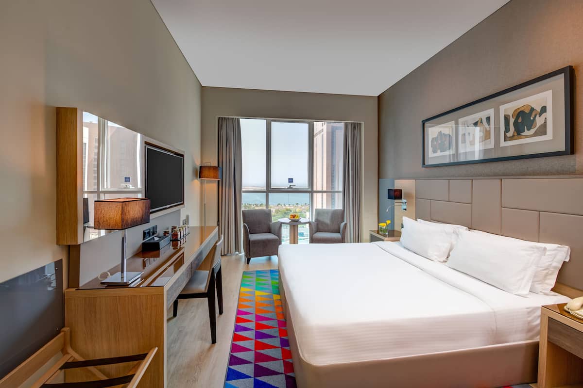 Quarto Duplo Deluxe, vista para o mar | Minibar, cofre com capacidade para portátil, secretária