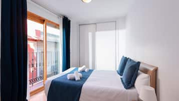 Apartamento, 1 quarto | 1 quarto, cortinas blackout, ferros/tábuas de passar roupa