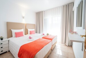 Apartamento Standard, 2 quartos | Cofre no quarto, Wi-fi grátis, roupa de cama fornecida