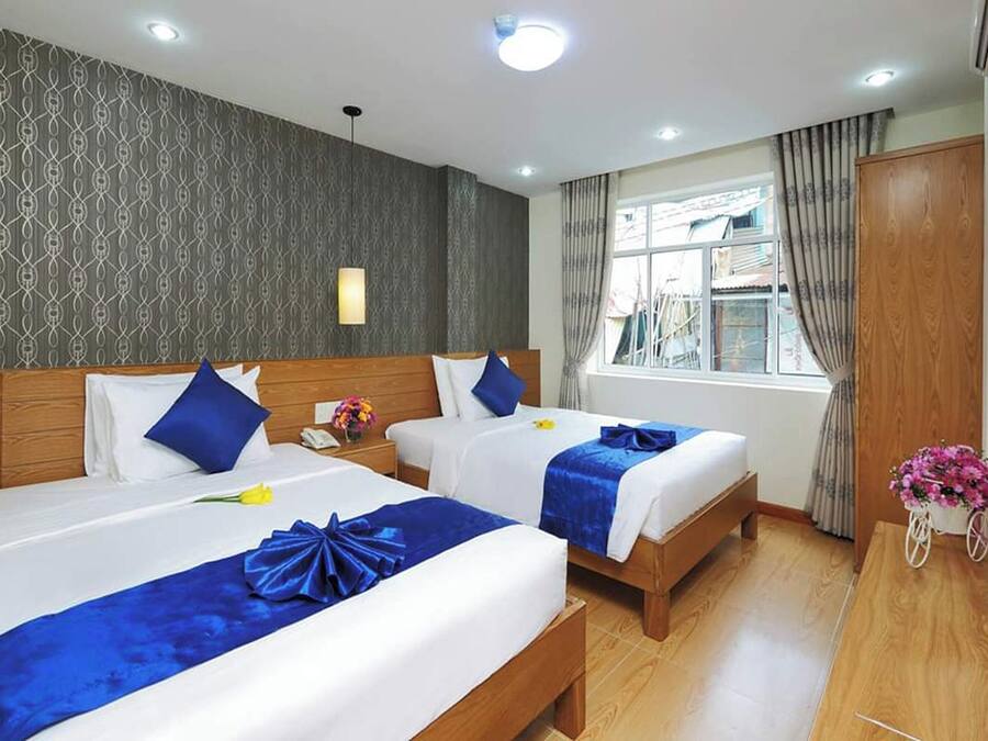 Quarto Twin Deluxe | Minibar, cofre no quarto, secretária, Wi-fi grátis