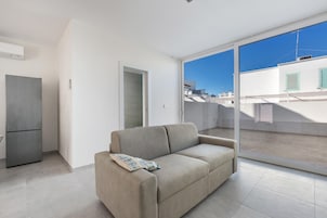 Apartamento | Sala de estar | TV de ecrã plano