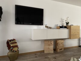 Apartamento conforto, 1 quarto | Área de estar