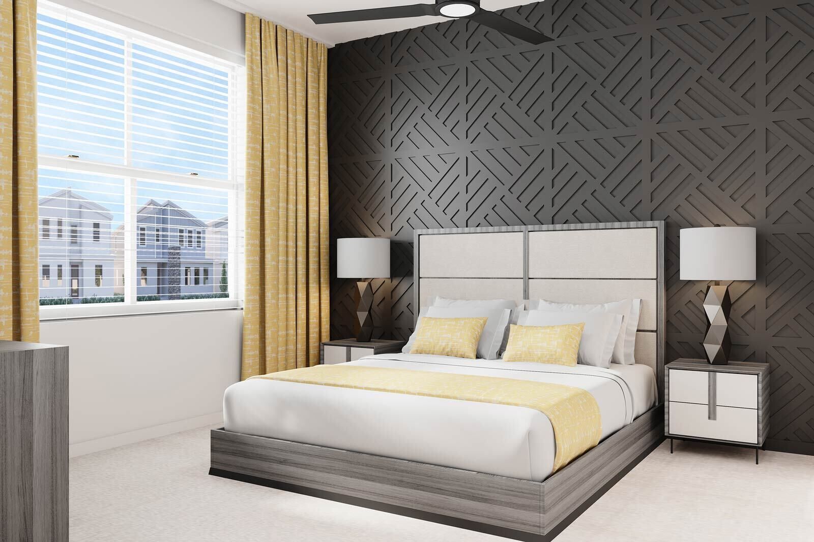 Quarto moderno com uma cama grande, duas mesinhas de cabeceira, um ventilador de teto e vista para prédios através de janelas amplas.