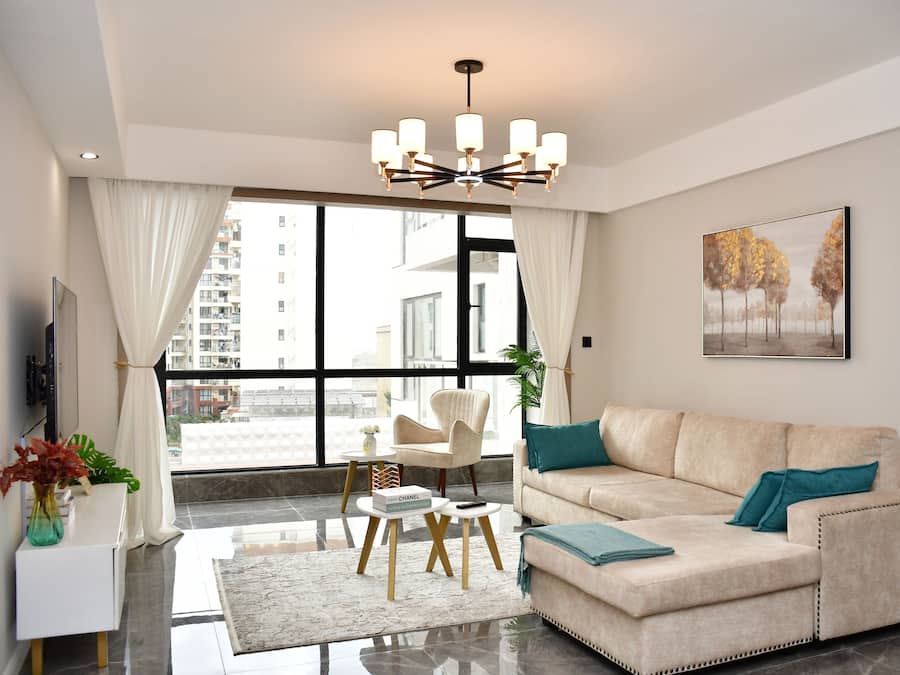 Apartamento, 2 camas queen-size, vista para o jardim | Sala de estar