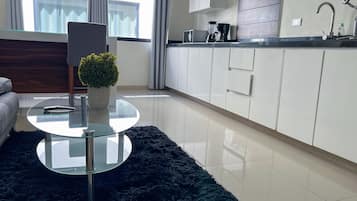 Suíte família, 1 quarto | Cozinha privada | Geladeira, micro-ondas, cooktop, liquidificador