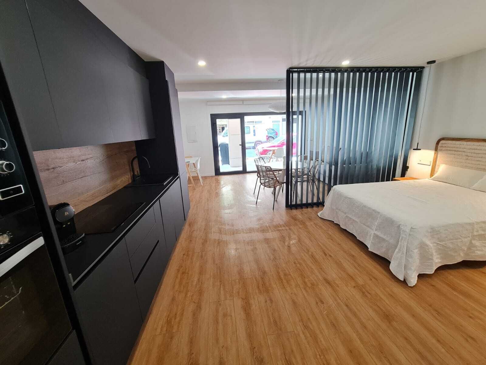 Apartamento galeria | Área de estar | TV de tela plana