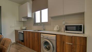 Apartamento de Luxo | Cozinha privada | Uma chaleira elétrica