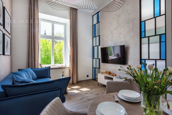 Apartamento Deluxe, 1 cama queen-size e sofá-cama, não fumadores | Sala de estar | Smart TV de 50 polegadas com canais por cabo, Netflix