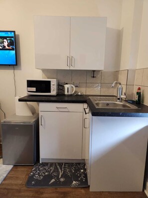 Apartamento | Cozinha privada | Geladeira, micro-ondas, fogão, cooktop