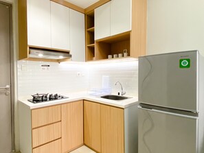 Apartamento | Cozinha privada | Geladeira grande, cooktop