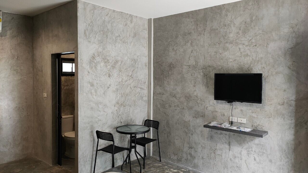 Quarto design, 1 cama Queen | Área de estar | Smart TV 40 polegadas com canais a cabo, Netflix, serviços de streaming