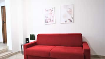Apartamento urbano | Área de estar | TV de tela plana