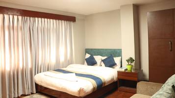 Suite Deluxe | 1 quarto, ferro/tábua de engomar, Wi-fi grátis, roupa de cama fornecida