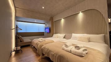 Apartamento superior, várias camas, cozinha americana, vista para a cidade | Área de estar | TV LED 42 polegadas com canais digitais, Netflix, serviços de streaming