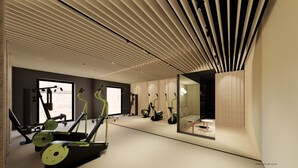 Uma academia moderna com equipamentos de ginástica, amplas janelas e design minimalista.