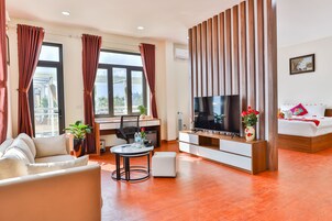 Suíte júnior | Roupas de cama premium, edredons de pluma, frigobar