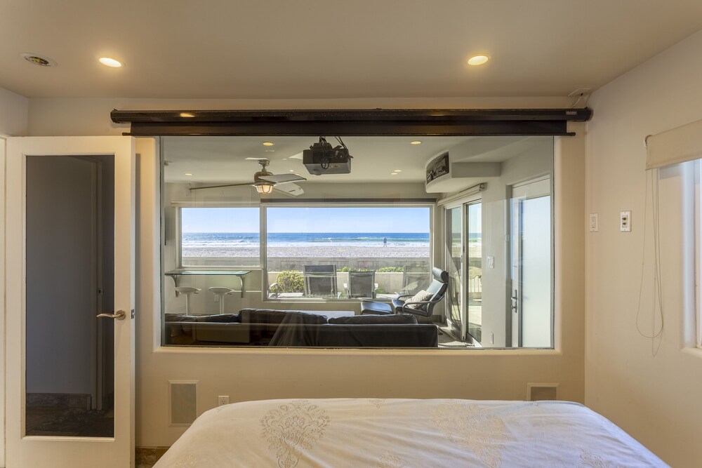 Oceanfront Surfrider windows to waves directly on the boardwalk with ...