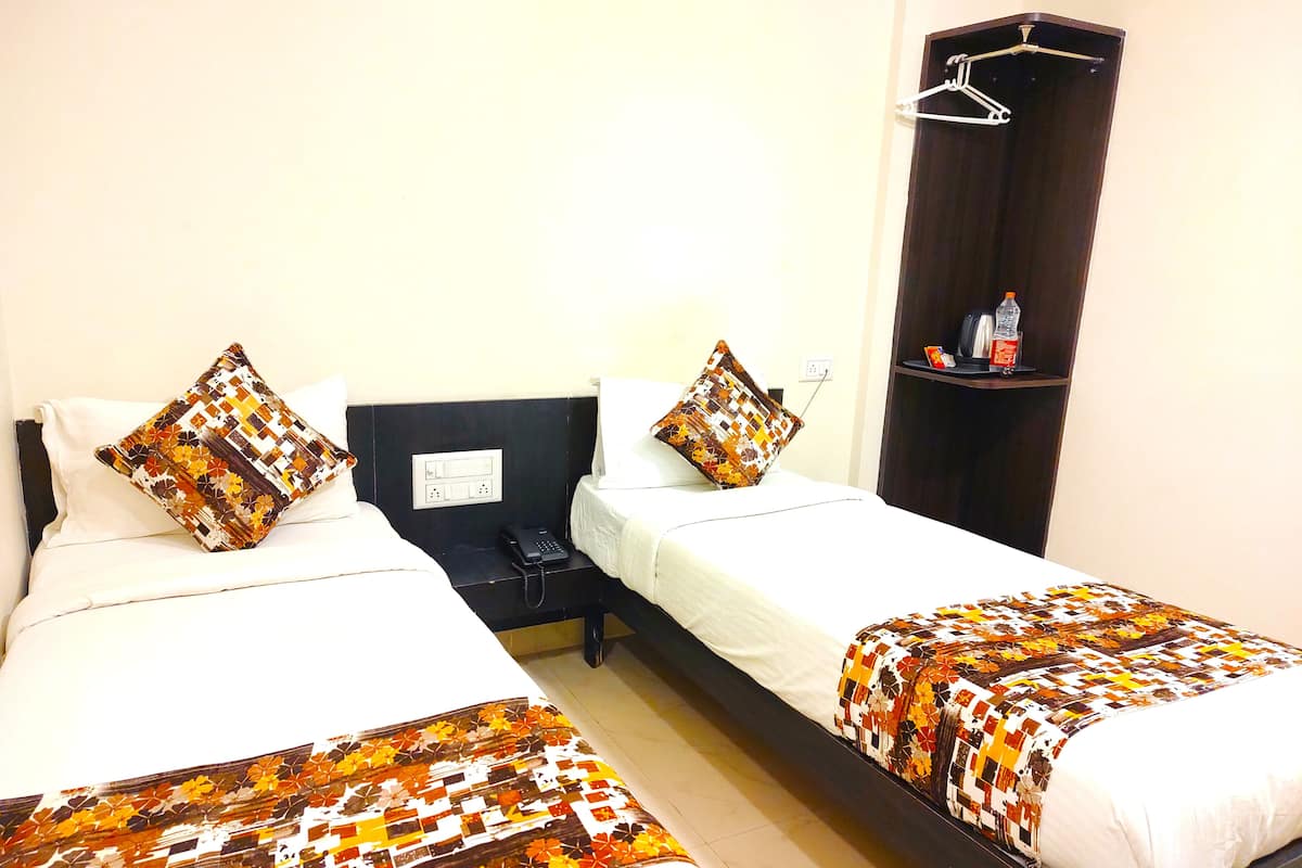 Quarto Duplo ou Twin Deluxe | 1 quarto, ferro/tábua de engomar, Wi-fi grátis