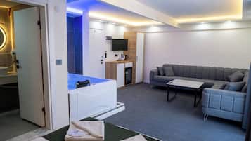 Quarto Duplo Deluxe | Sala de estar | Smart TV de 65 polegadas com canais via satélite