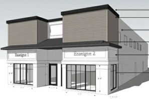 Um edifício de dois andares com sinalização para 'Enseigne 1' e 'Enseigne 2'.