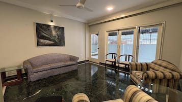 Quarto casal luxo | Área de estar