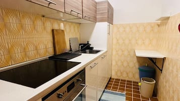 Apartamento superior, várias camas | Cozinha privada