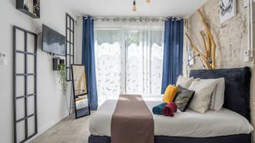 Quarto Deluxe, vista para o jardim | 2 quartos, com decoração personalizada, com mobília individualizada